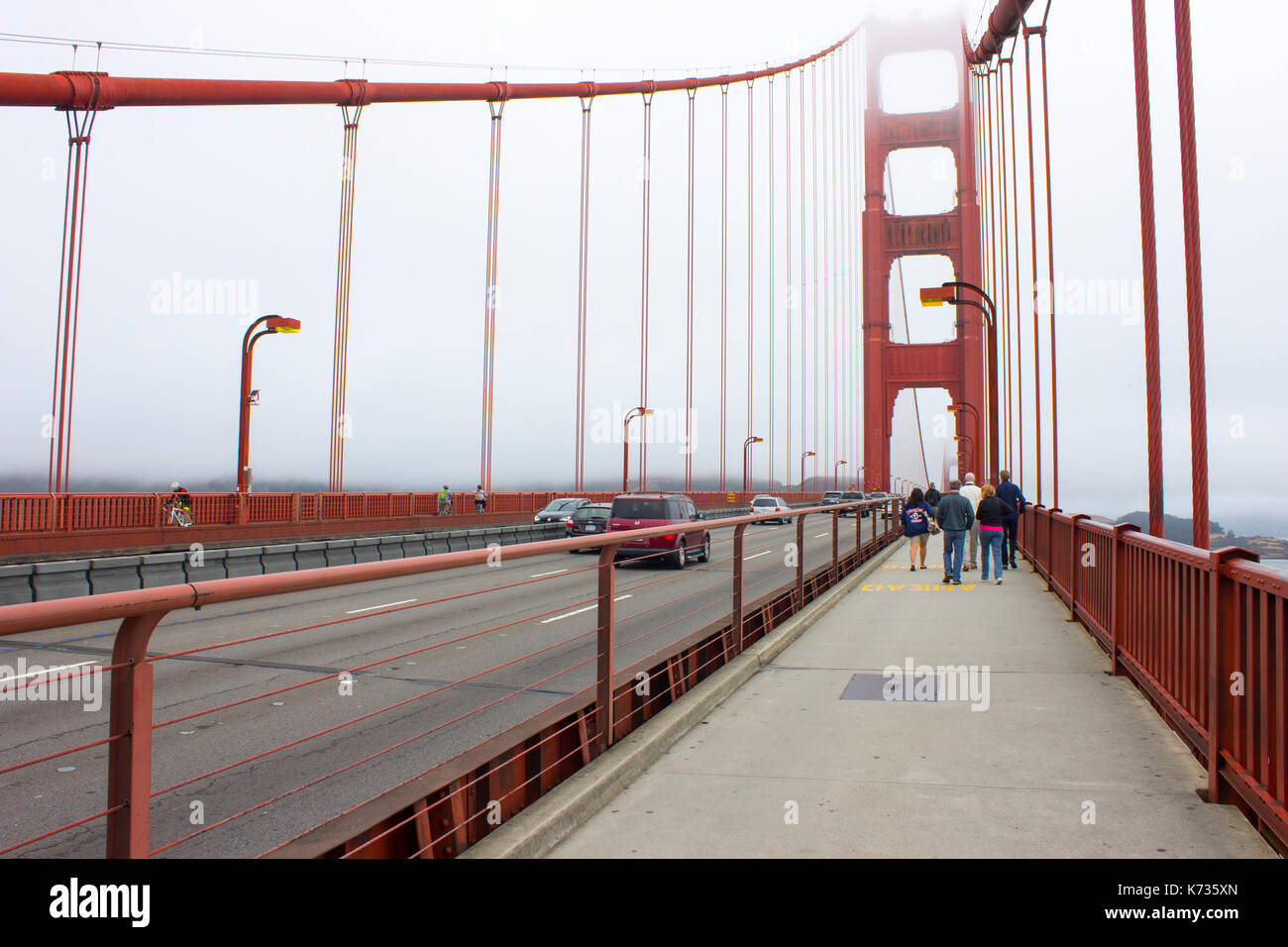 The Golden Gate Bridge, a painted red suspension bridge spanning the ...