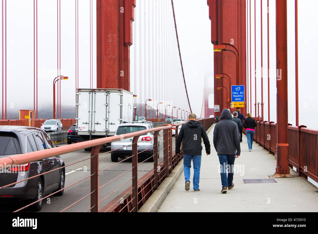 The Golden Gate Bridge, a painted red suspension bridge spanning the ...