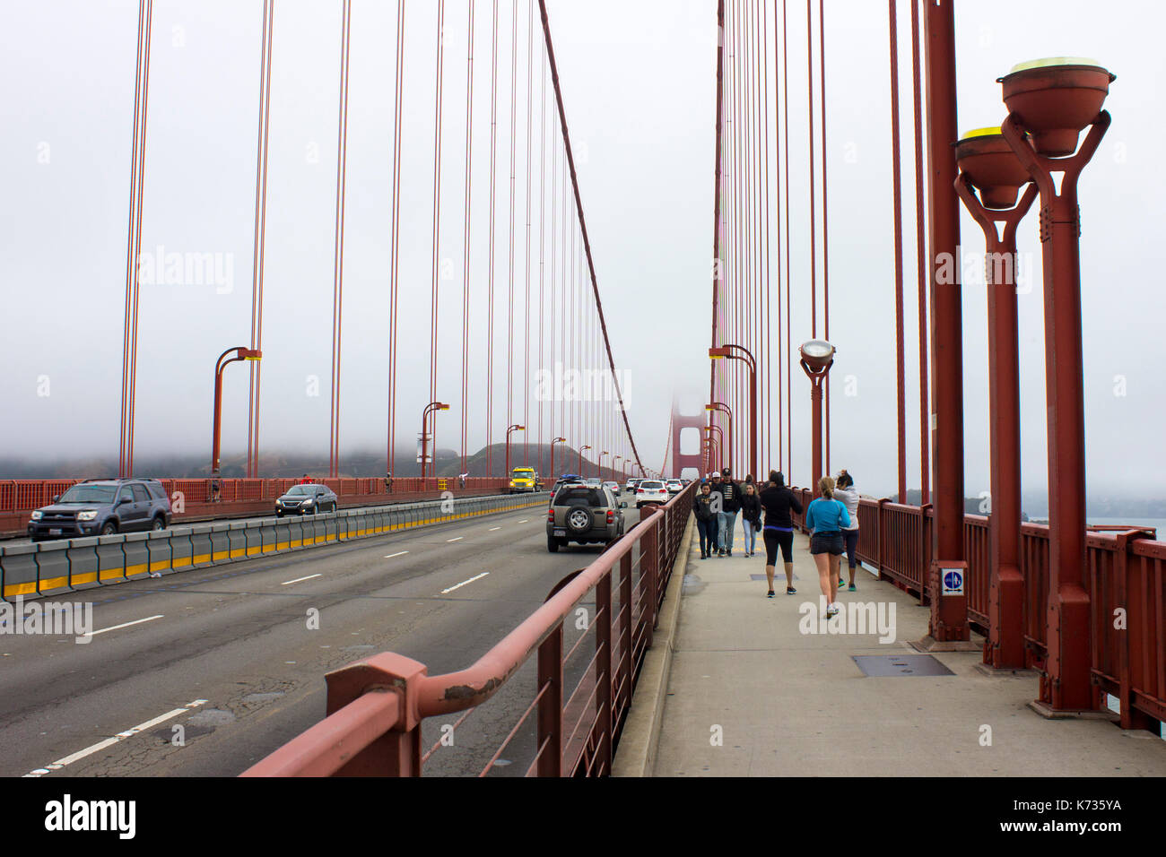 The Golden Gate Bridge, a painted red suspension bridge spanning the ...