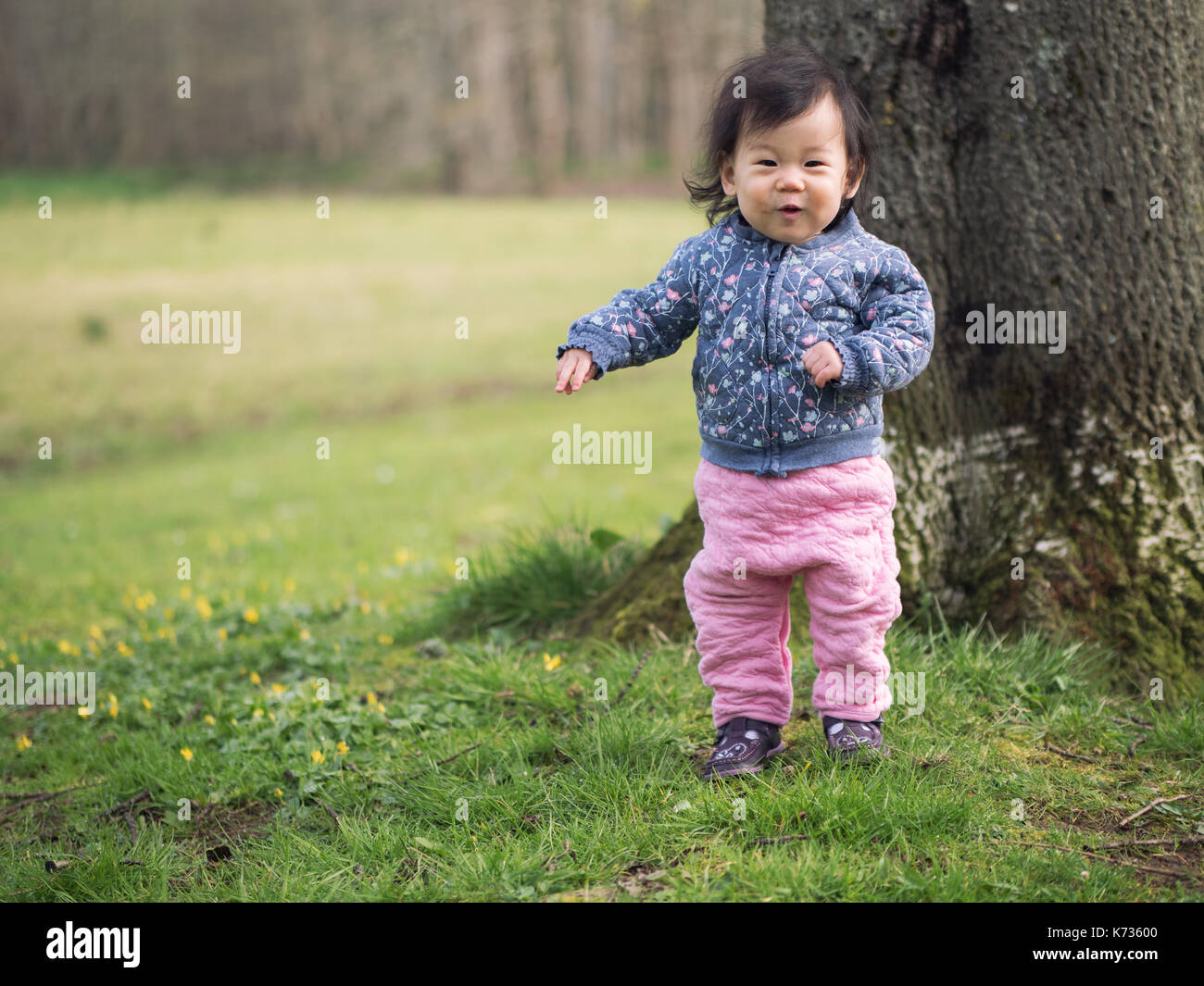 baby girl walking outdoor first time Stock Photo - Alamy