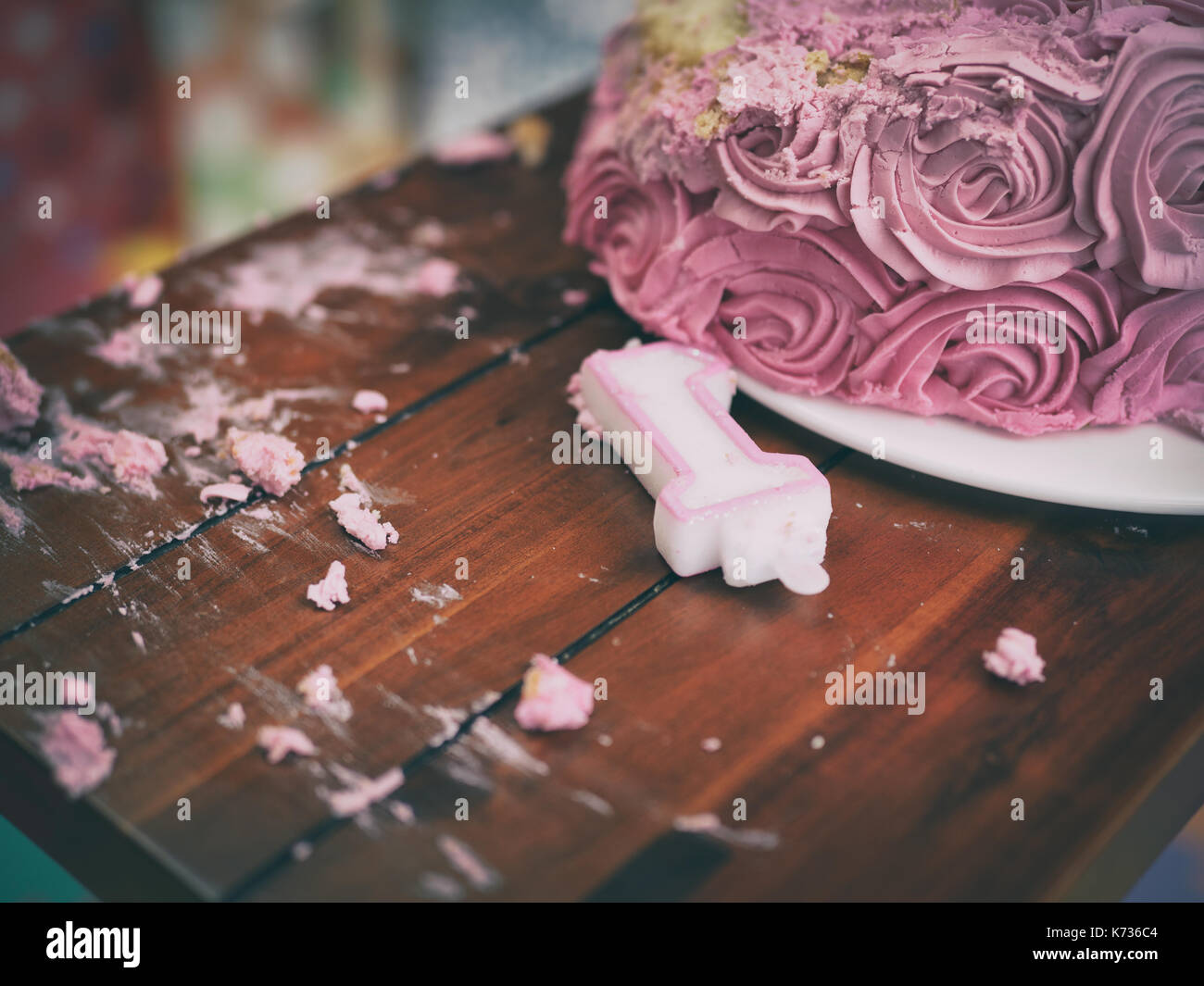 smashed cake by baby on her first birthday party Stock Photo - Alamy