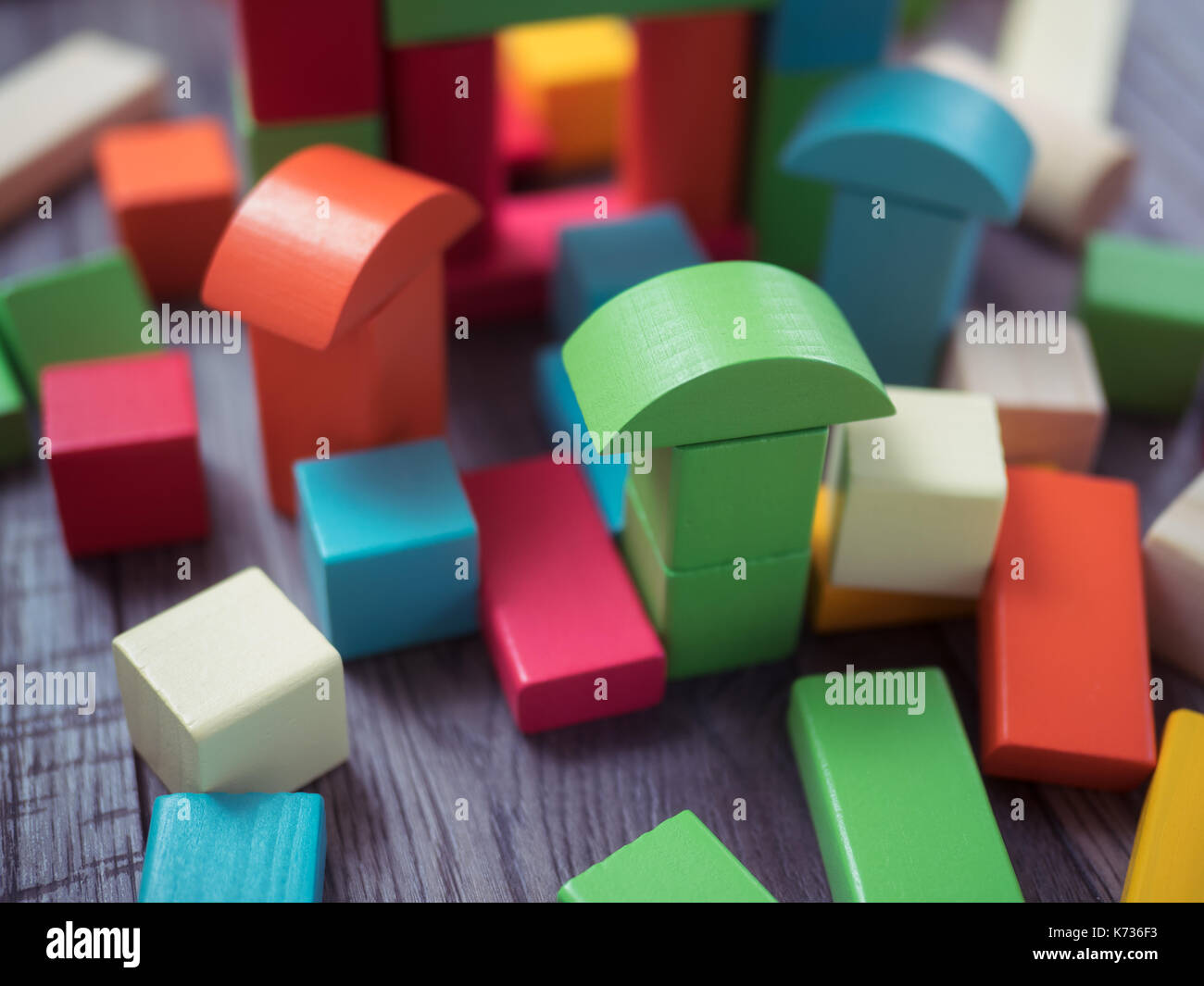 Wooden toy blocks background Stock Photo - Alamy