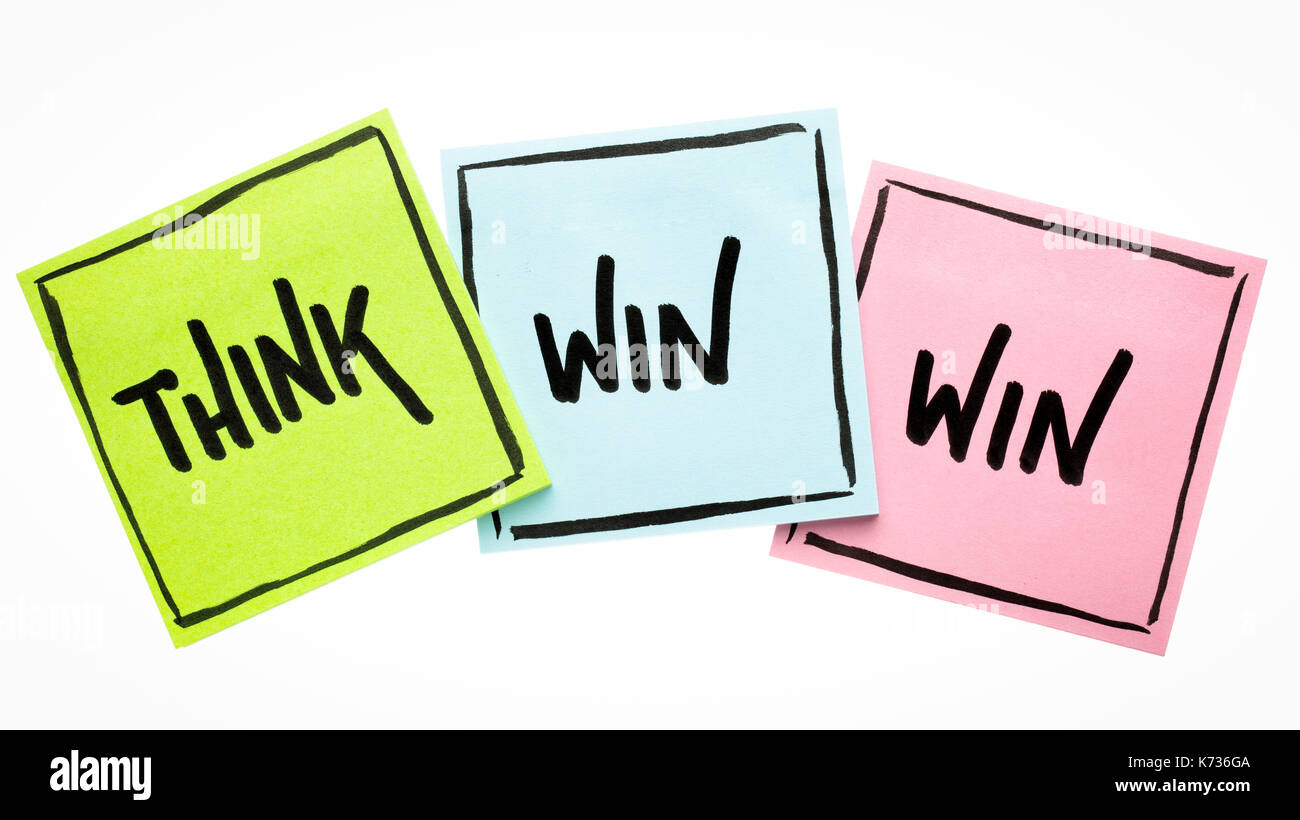 Think win-win concept - handwriting on sticky notes isolated on white ...