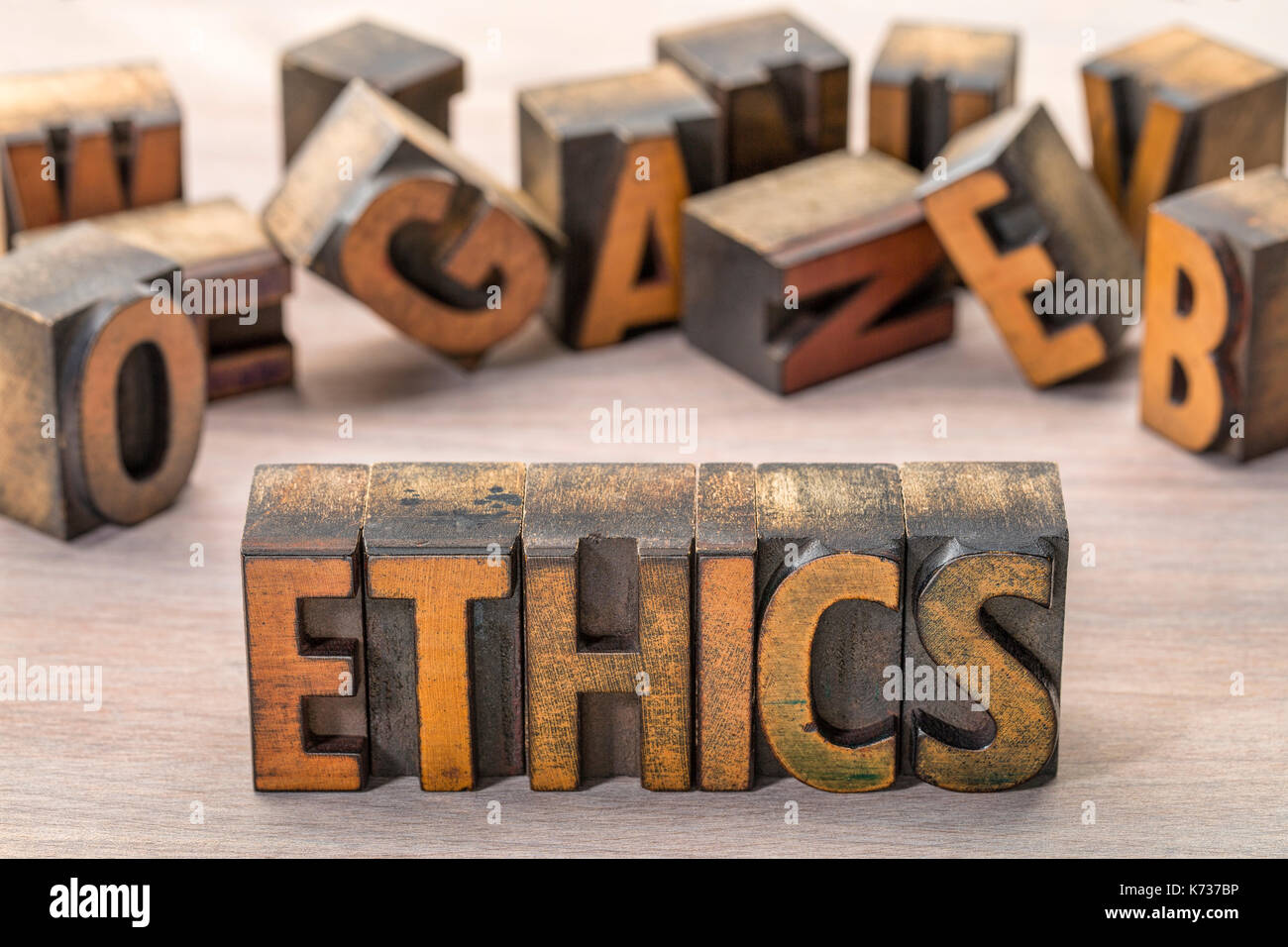 ethics word - text in letterpress wood type blocks against grained wood ...