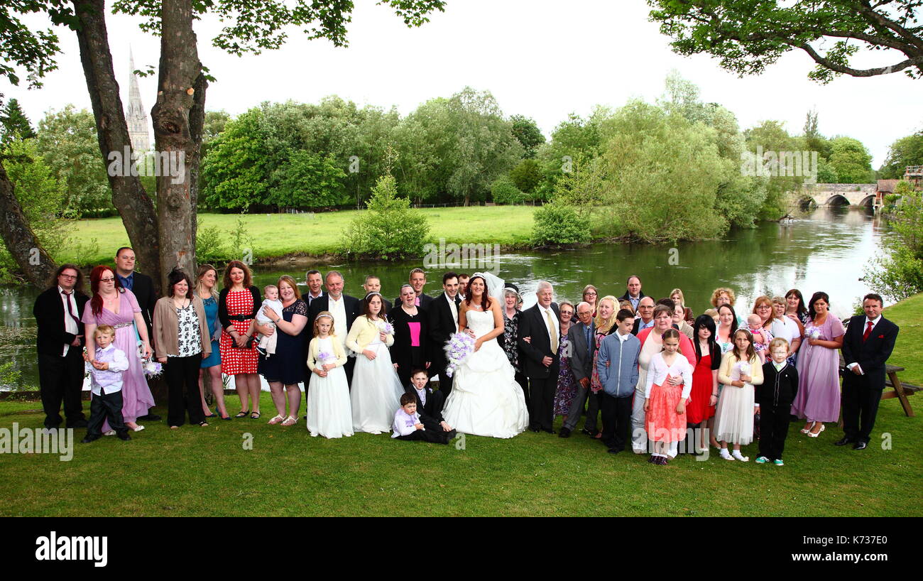 Wedding Photographs, a couple celebrate their special day with family ...
