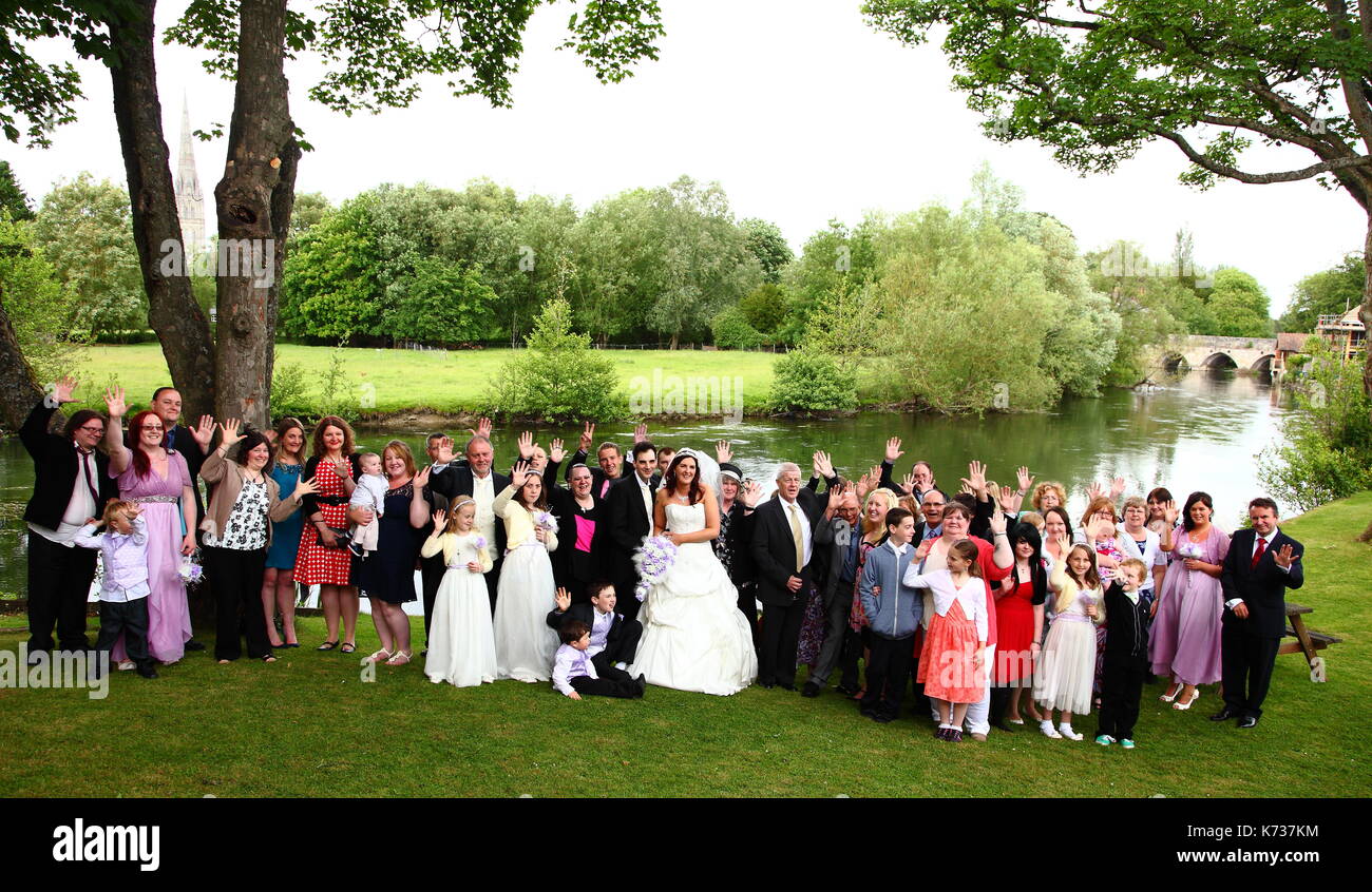 Wedding Photographs, a couple celebrate their special day with family ...
