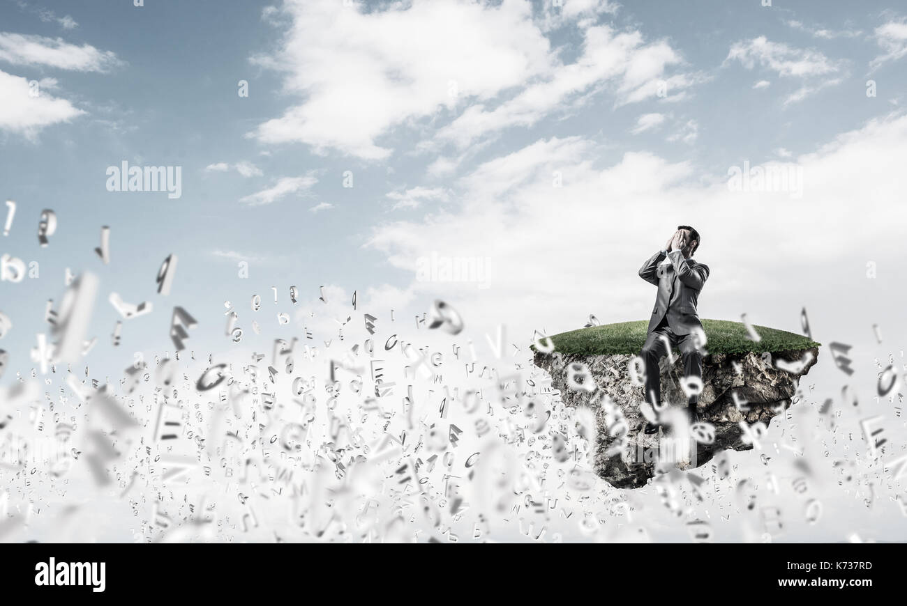 Young man floating in sky and do not want to see anything Stock Photo ...