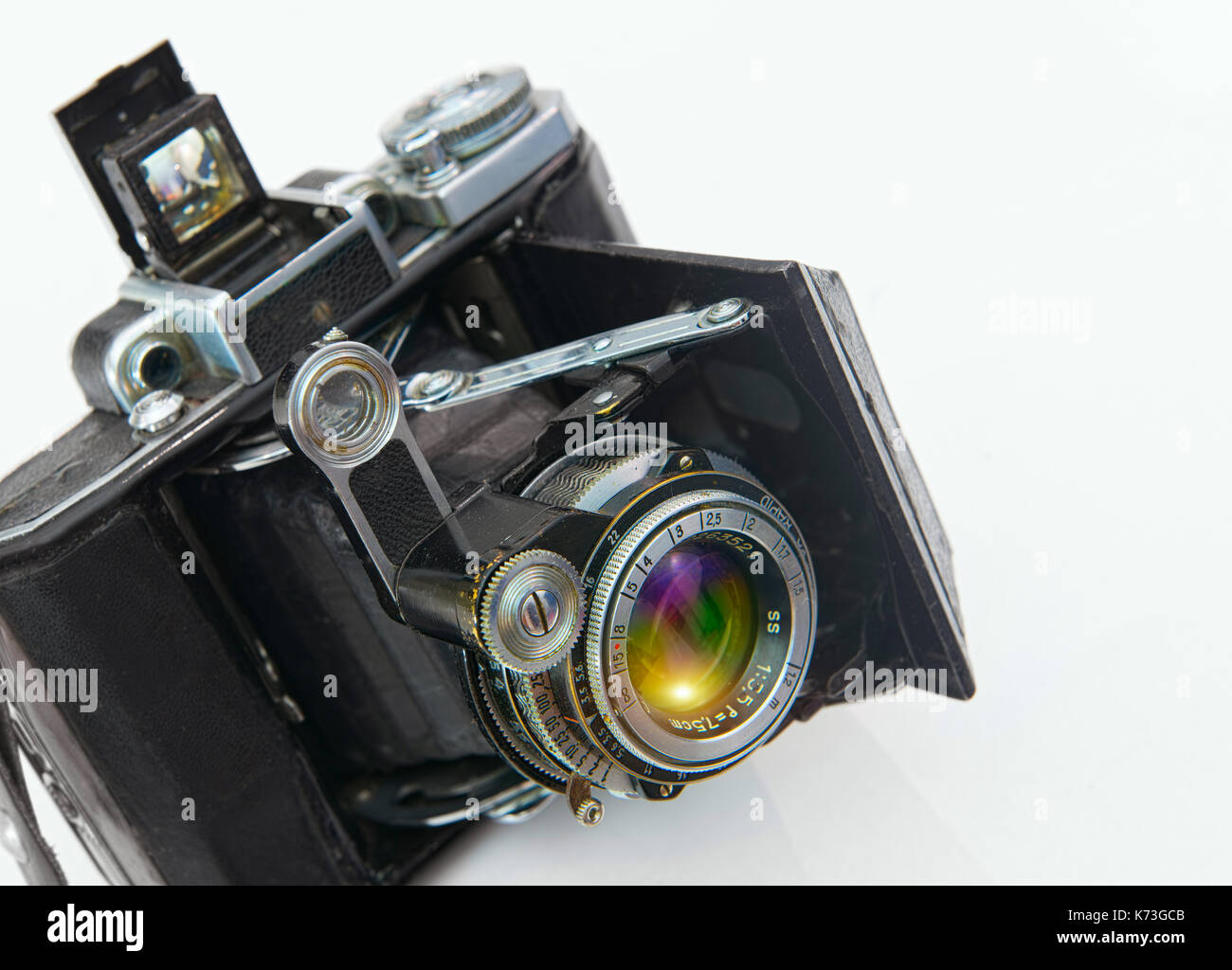 Old photo camera cut out on a white background Stock Photo - Alamy