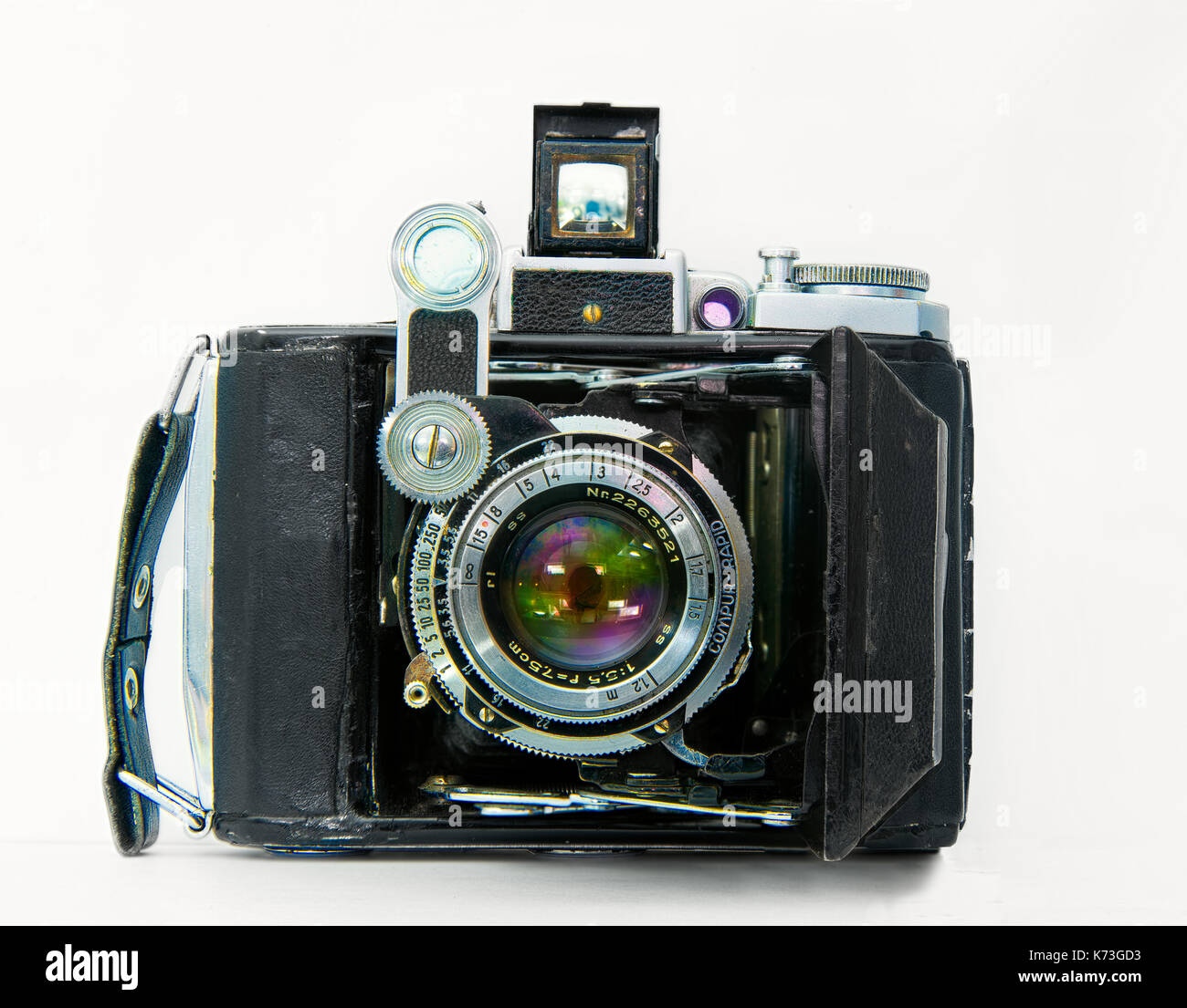 Old photo camera cut out on a white background Stock Photo - Alamy