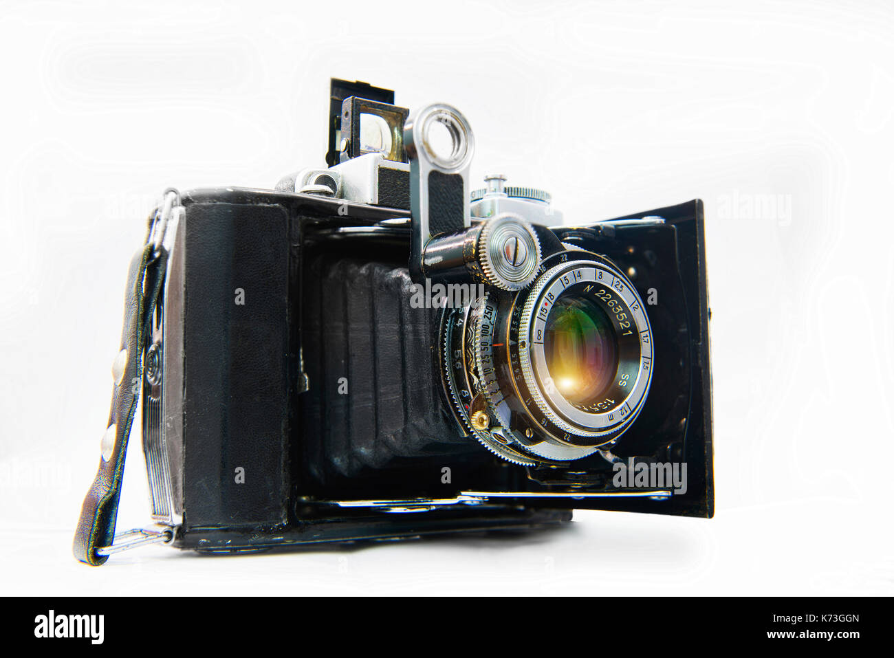 Old photo camera cut out on a white background Stock Photo - Alamy