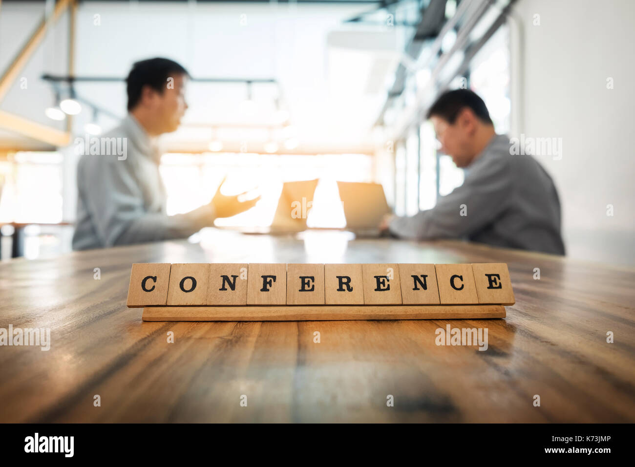 Conference word on wood table with Business team work discussion ...