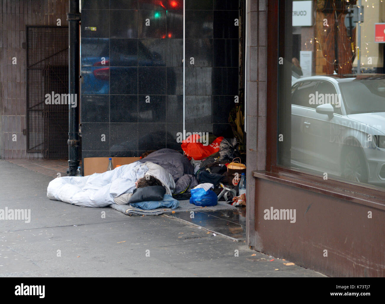 Homeless people sleeping in a doorway in Manchester UK Stock Photo - Alamy