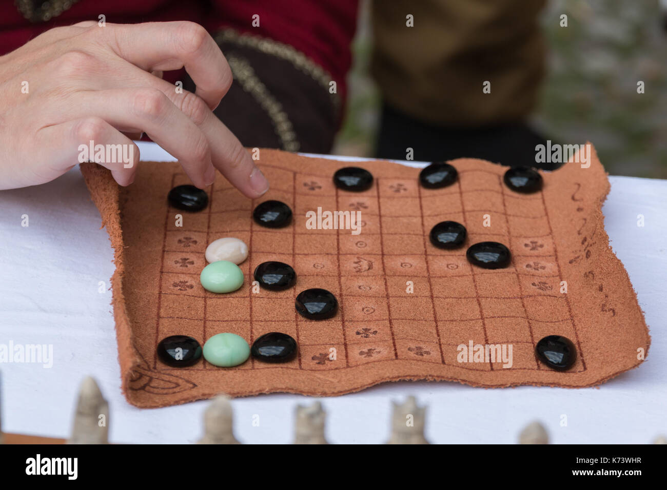 Antique Table Game with Colorful Oval Pieces and Brown Fabric Board ...