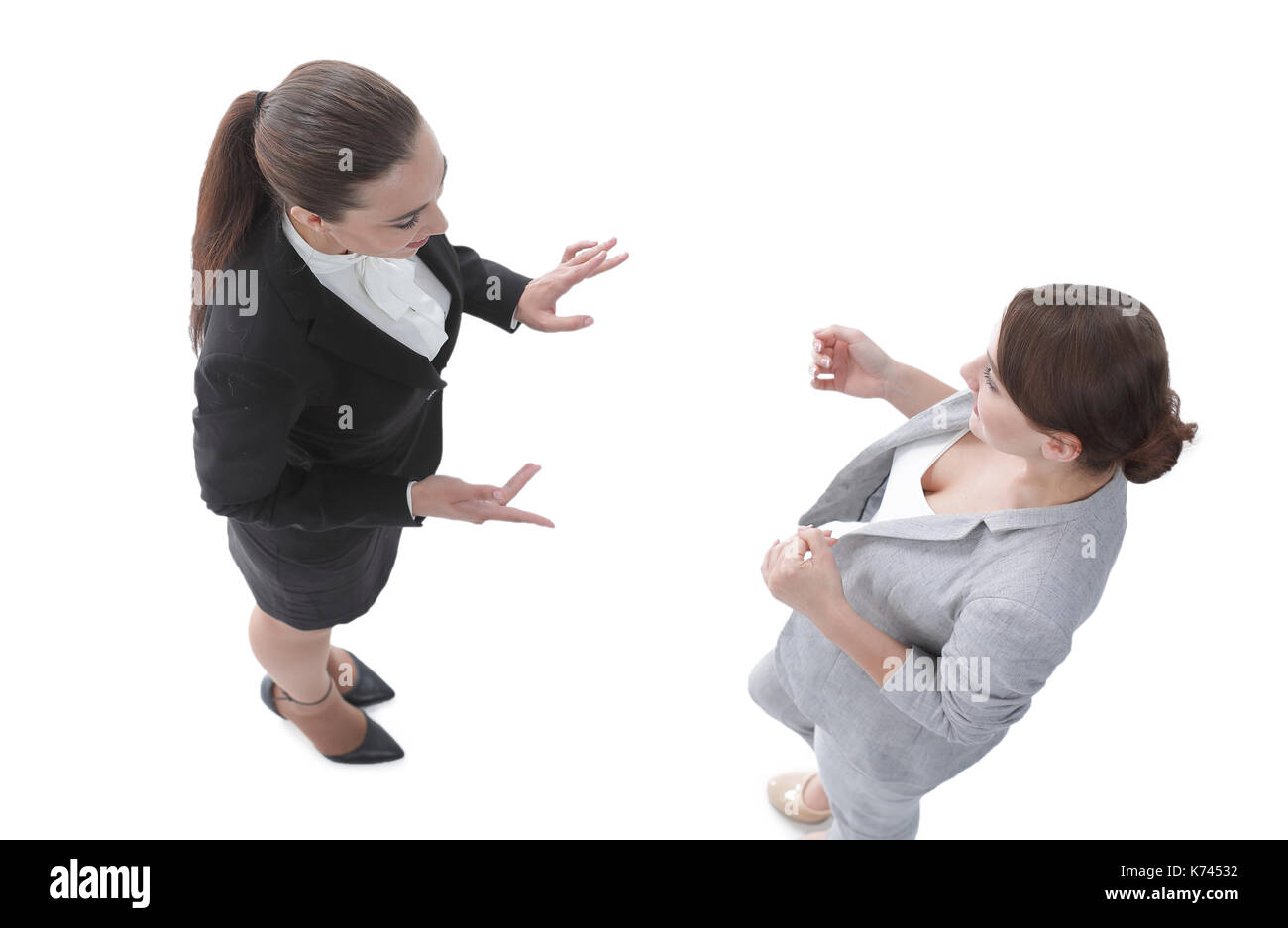 view from the top. two business women talking Stock Photo - Alamy