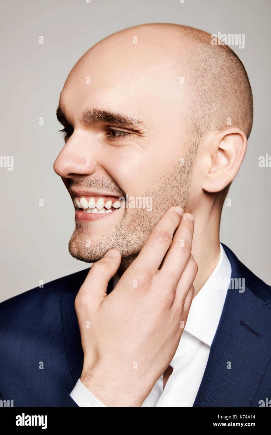 Close up of a smiling man looking right Stock Photo - Alamy