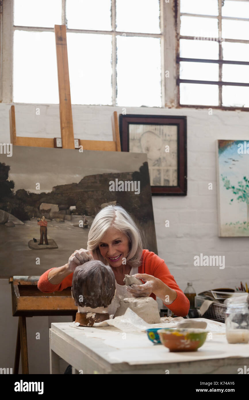 Woman creating clay sculpture hi-res stock photography and images - Alamy