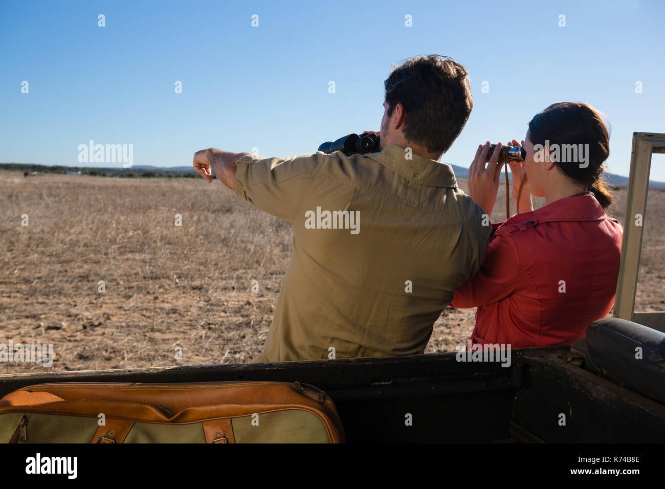 Binoculars view woman rear view hi-res stock photography and images - Alamy