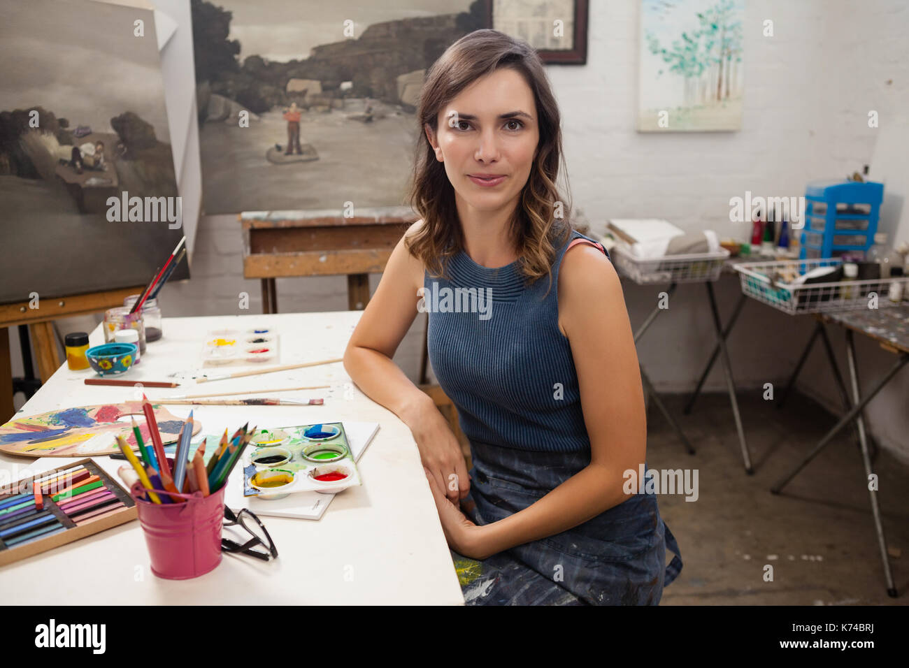 Portrait of woman sitting in drawing class Stock Photo - Alamy