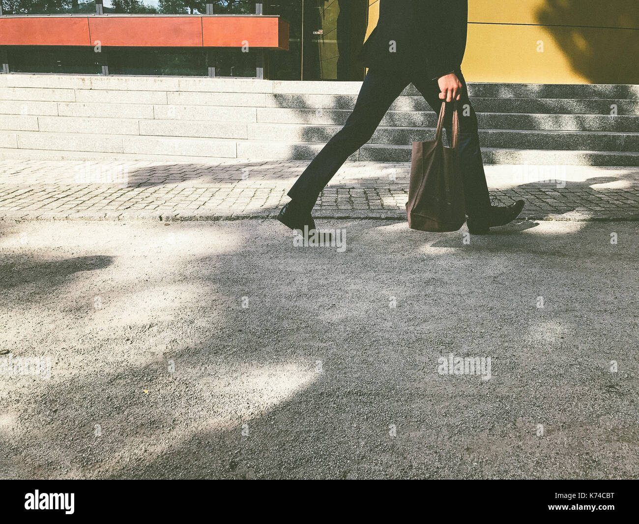 The man is walking fast along Stock Photo - Alamy