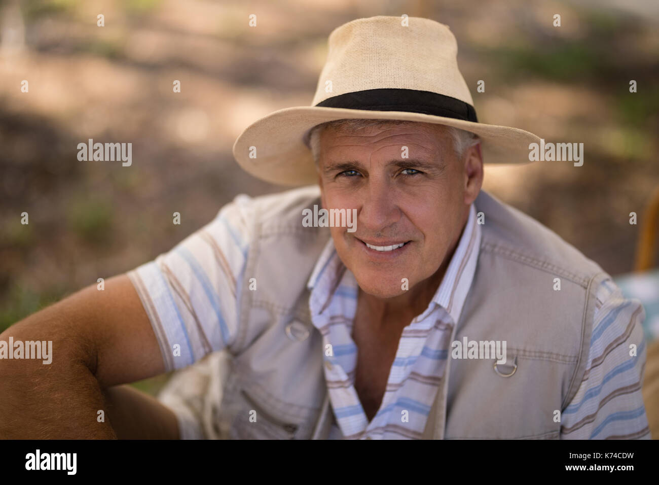 Happy man wearing hat typing hi-res stock photography and images - Alamy