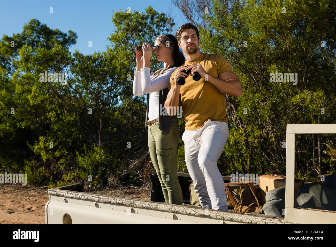 Couple using binoculars hi-res stock photography and images - Alamy