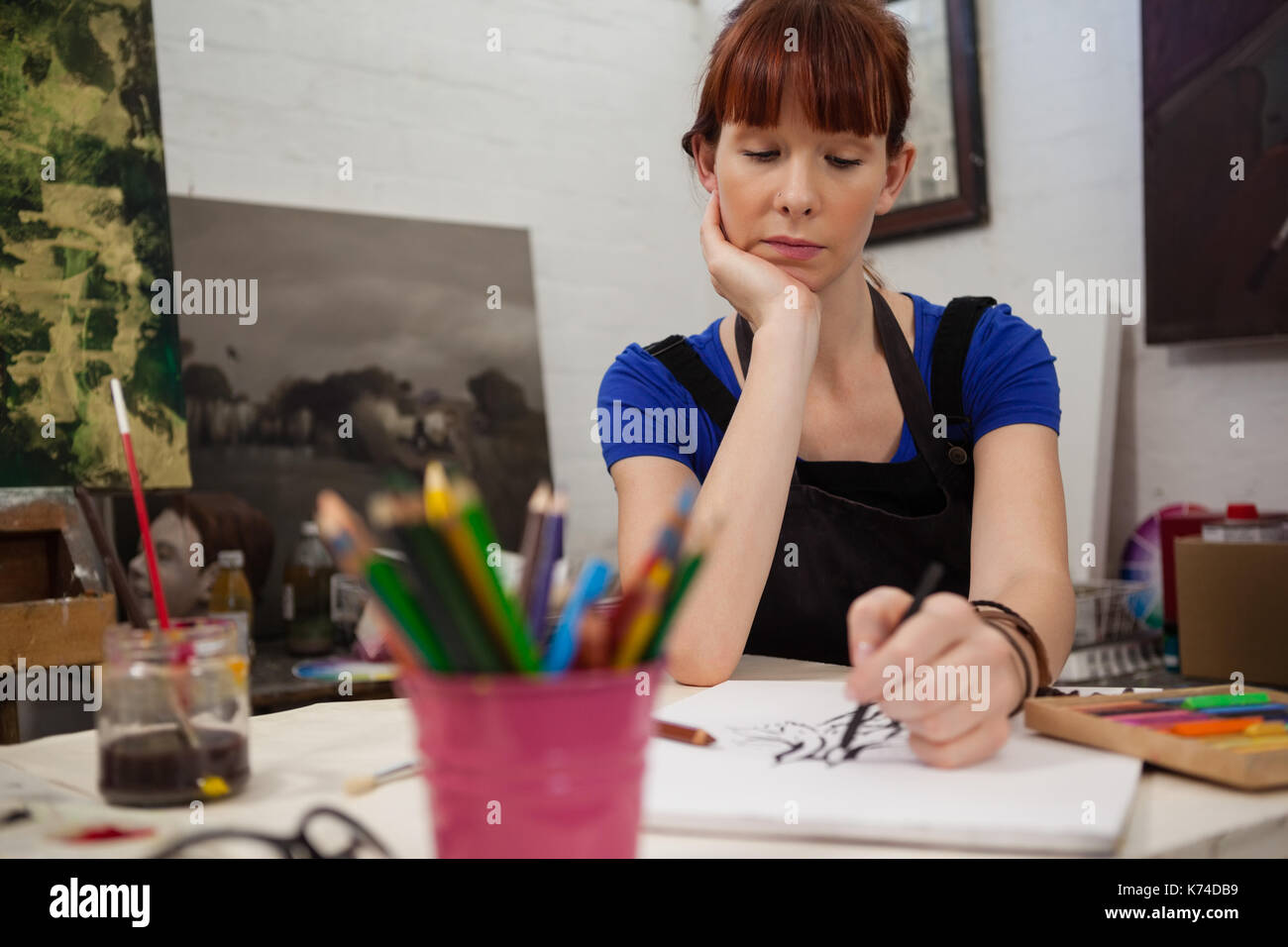 Drawing hobby focused woman sketching hi-res stock photography and ...