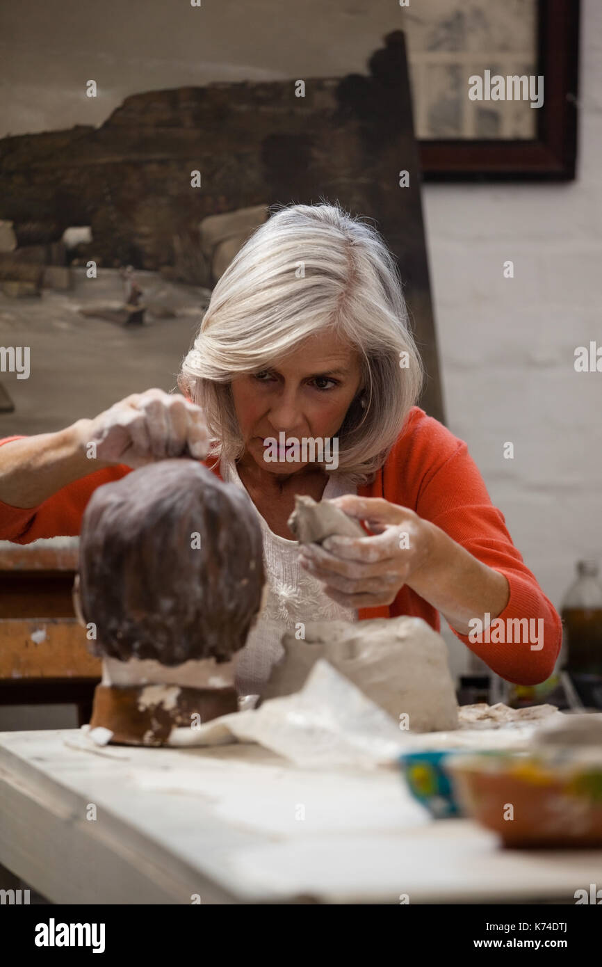 Woman creating clay sculpture hi-res stock photography and images - Alamy