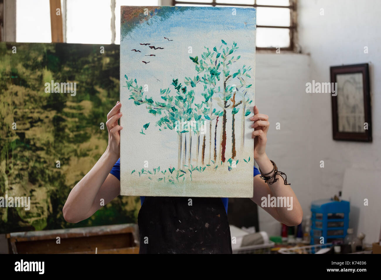 Hiding behind painting hi-res stock photography and images - Alamy