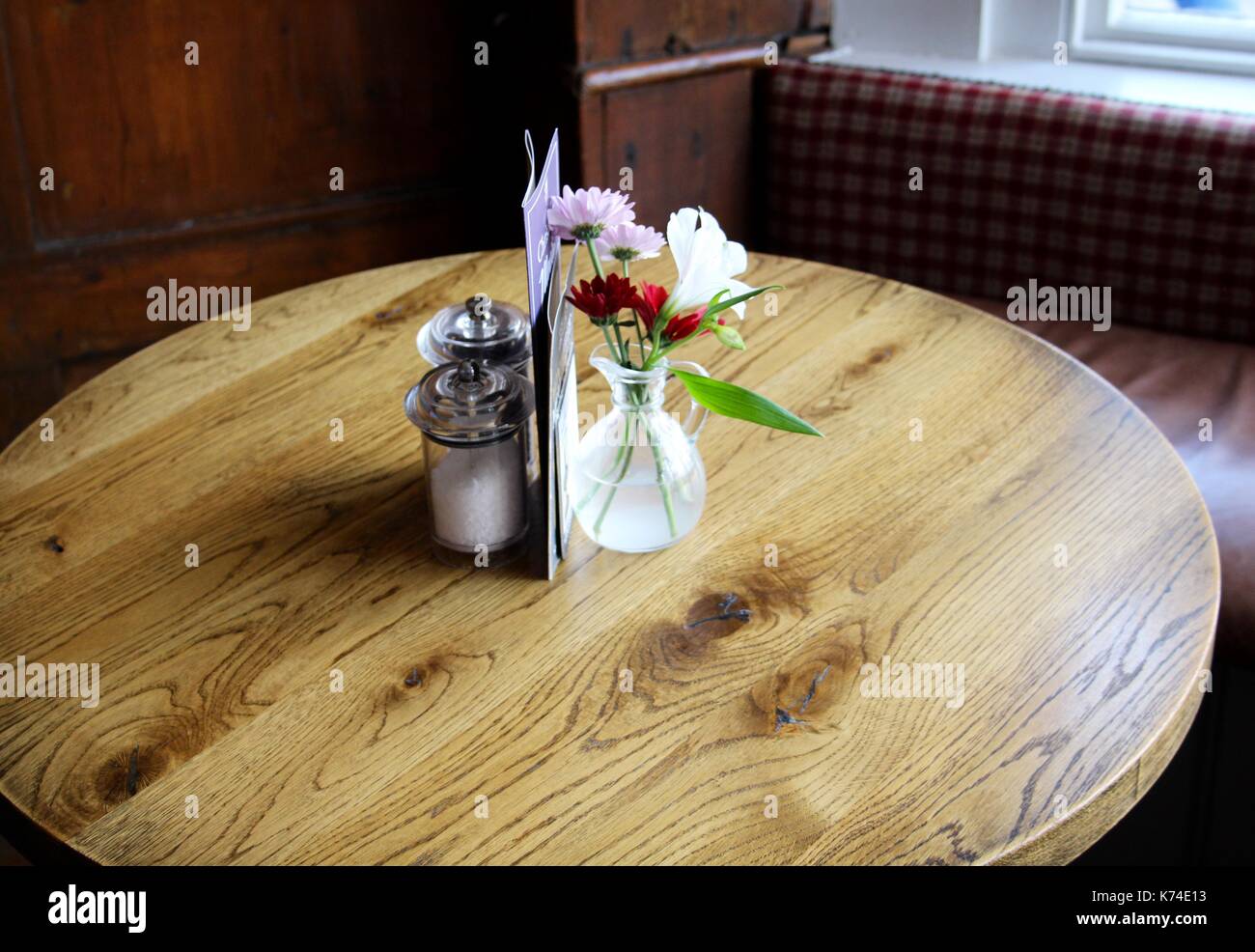 Round cafe or pub table Stock Photo - Alamy