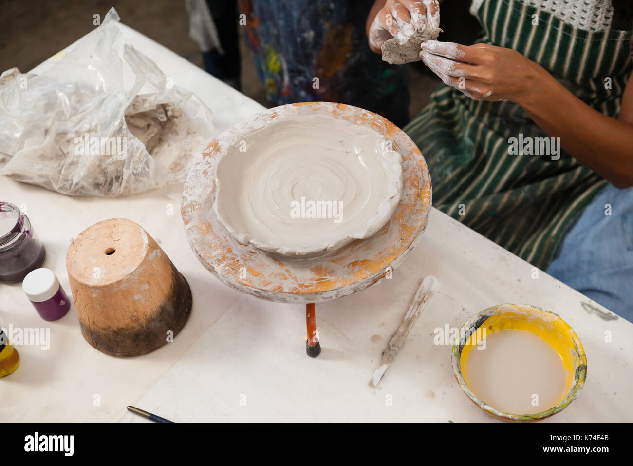 Mid section of woman learning pottery in class Stock Photo - Alamy