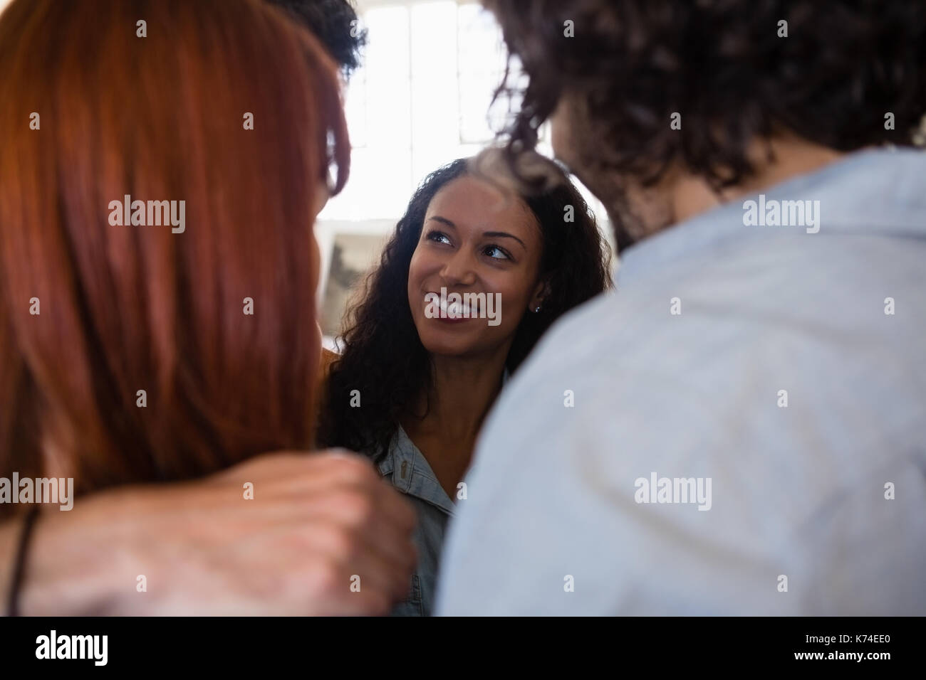 Group of friends in huddle smiling hi-res stock photography and images ...