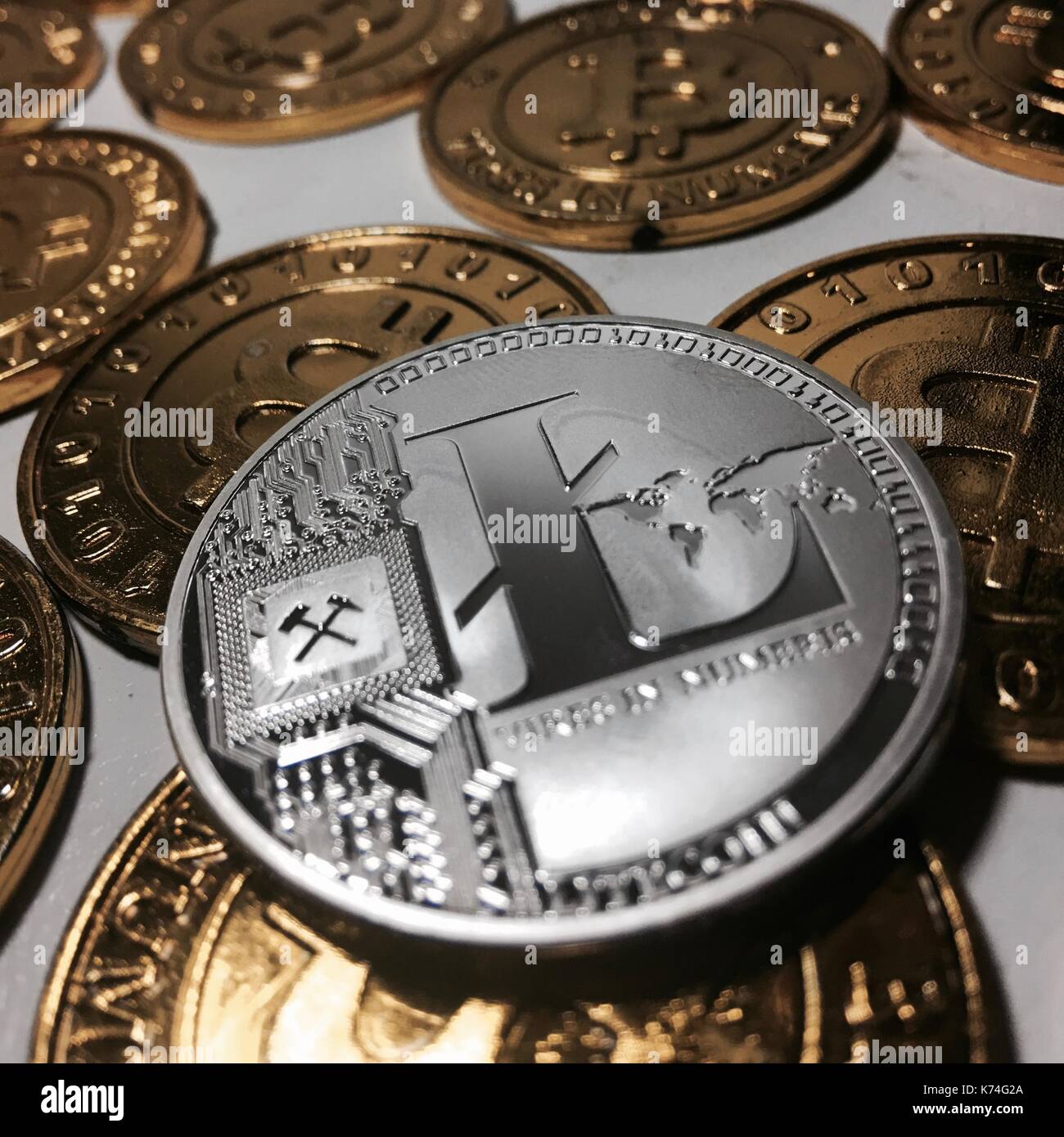 Digital currency physical metal litecoin coin near bitcoin coins. Money ...
