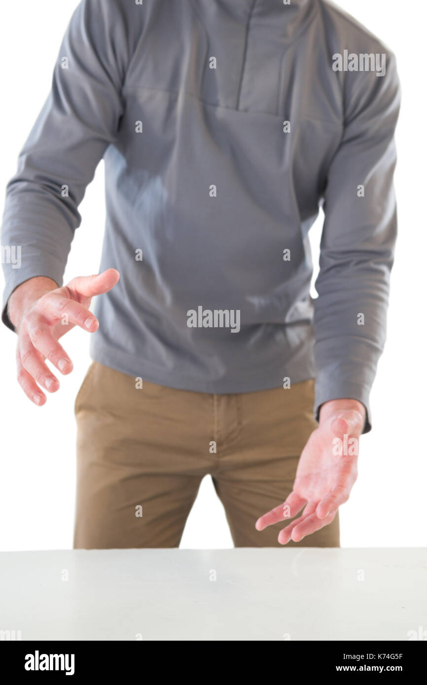 Mid section of businessman promoting invisible product during ...