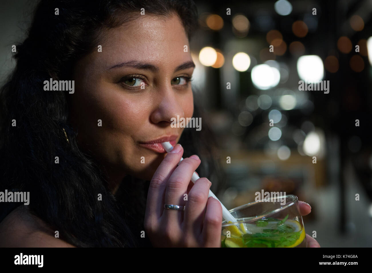 Portrait of beautiful woman drinking mocktail in restaurant Stock Photo ...
