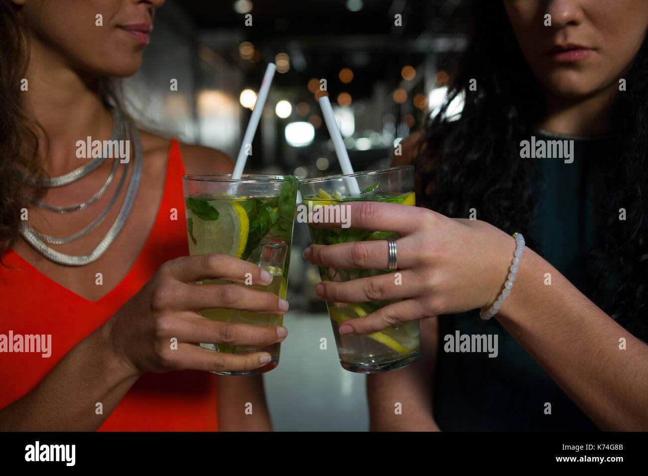 Mid section of friends toasting mocktails in restaurant Stock Photo - Alamy