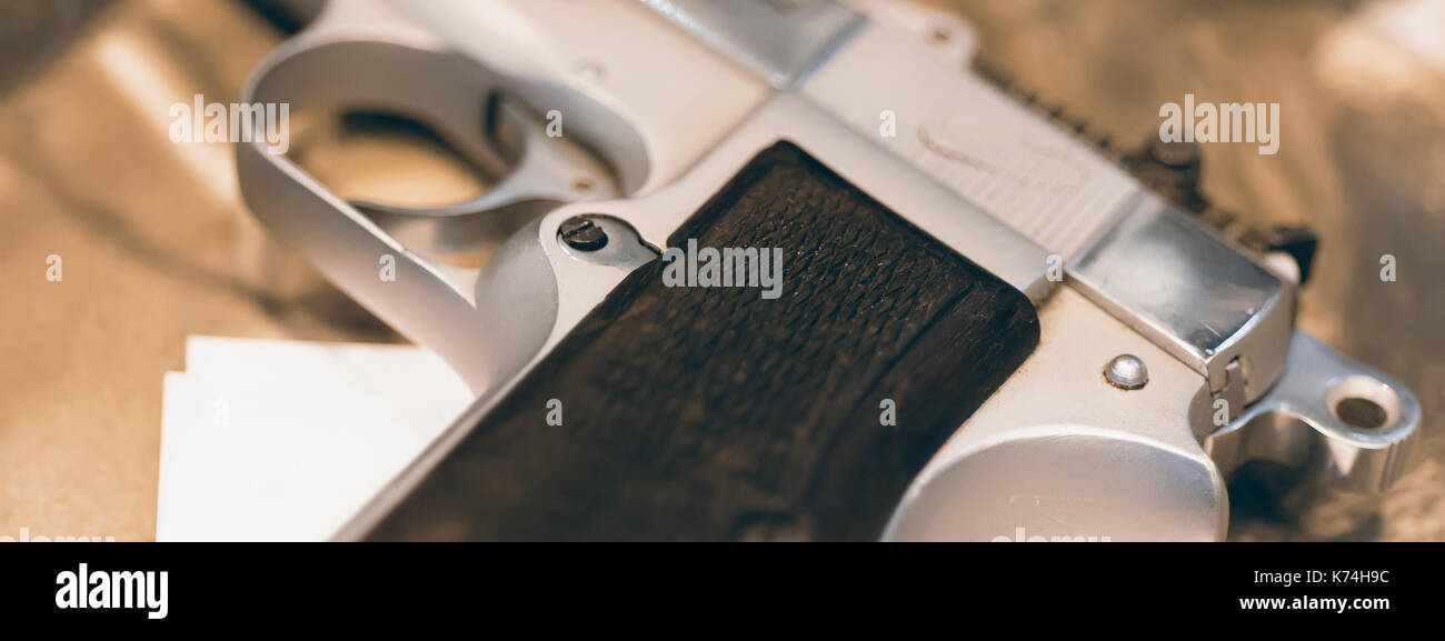 Pistol bullet gun table hi-res stock photography and images - Alamy