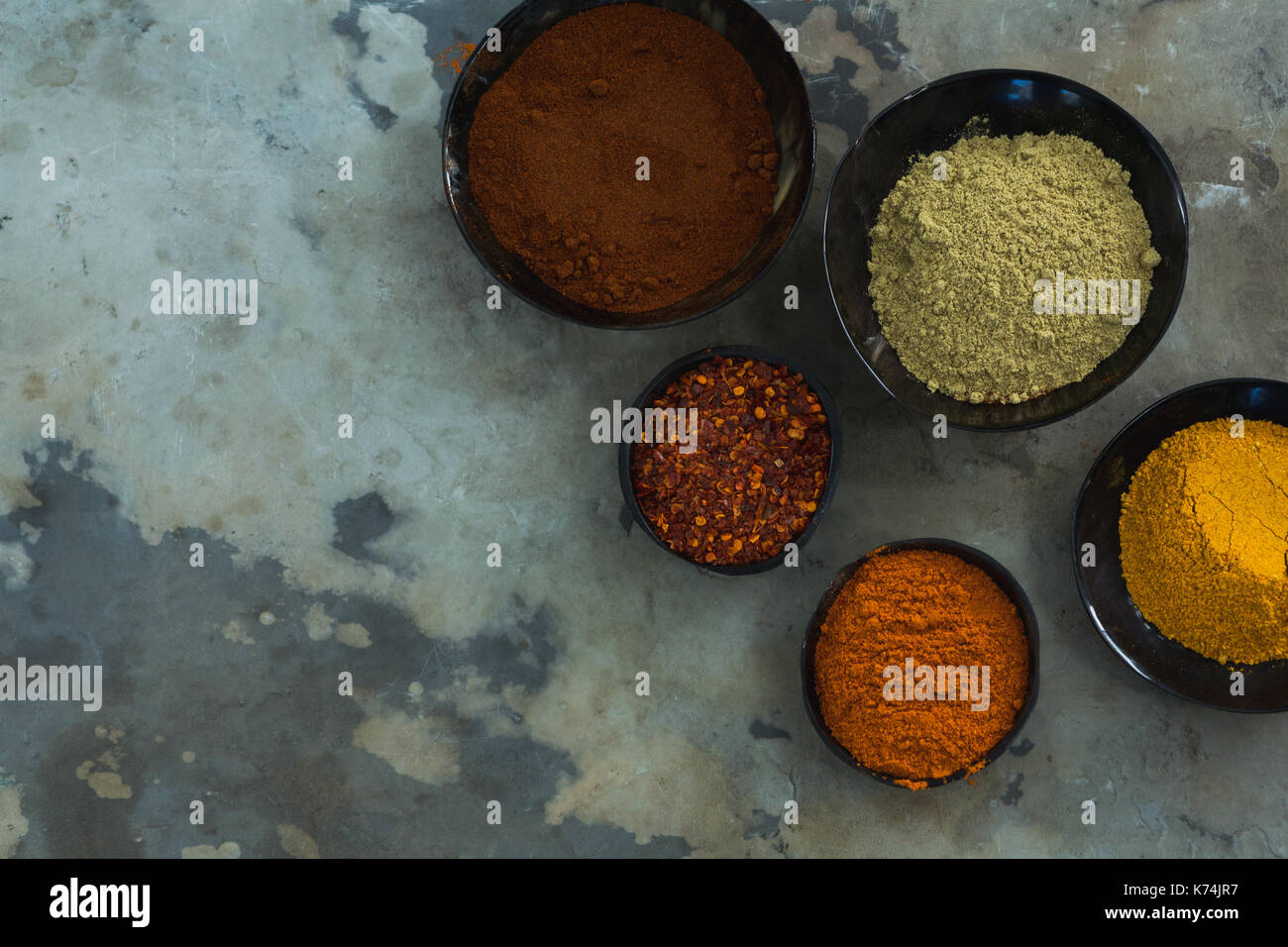 Overhead of various spices powder in bowl Stock Photo - Alamy