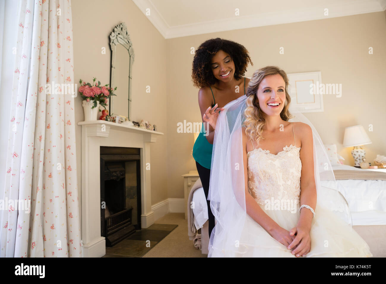 Bride sitting on bed hi-res stock photography and images - Alamy