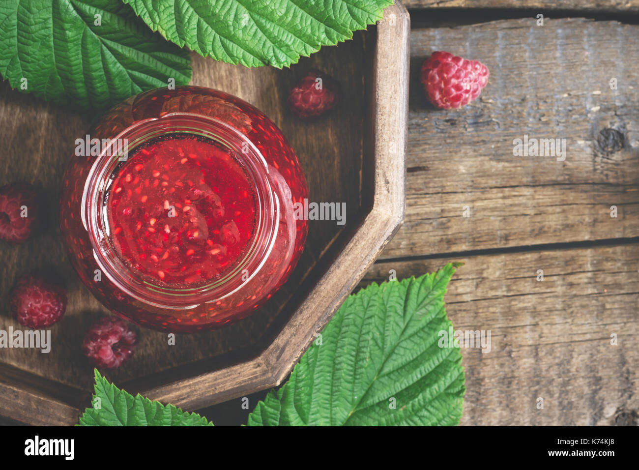 Homemade raspberry jam and fresh berries. Top view with copy space ...