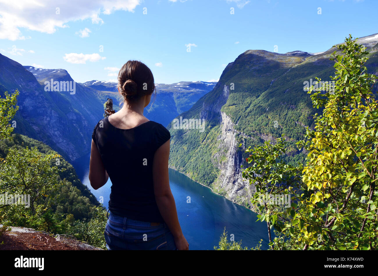 Geiranger, Norway - September 3rd, 2017: Girl hiking to Seven Sisters ...