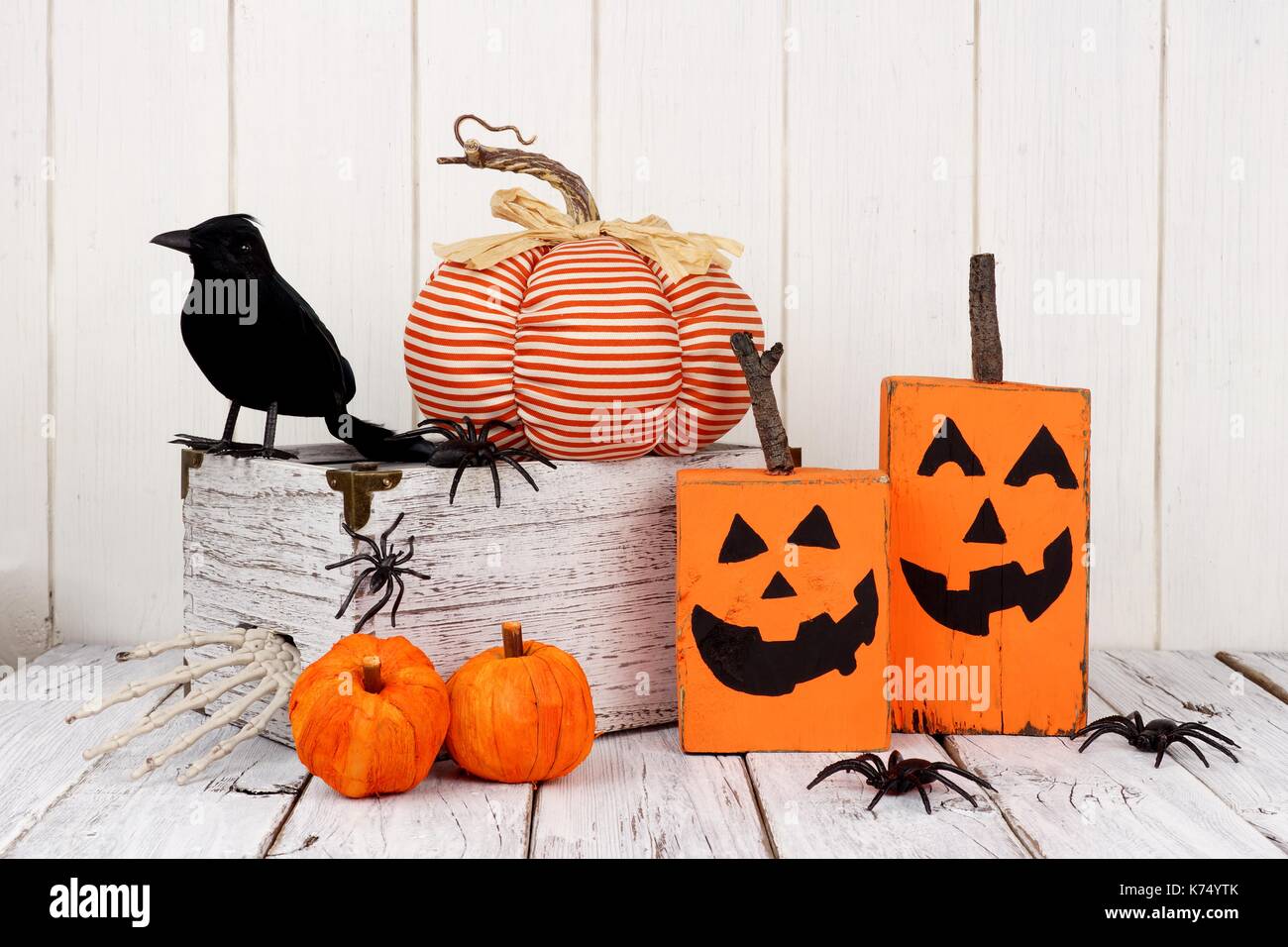 Rustic shabby chic Halloween decor against a white wood background ...