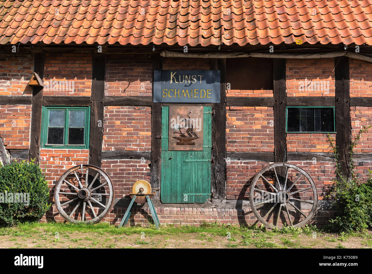 Facade of an art forge, blacksmith's shop, door, half-timbered building ...