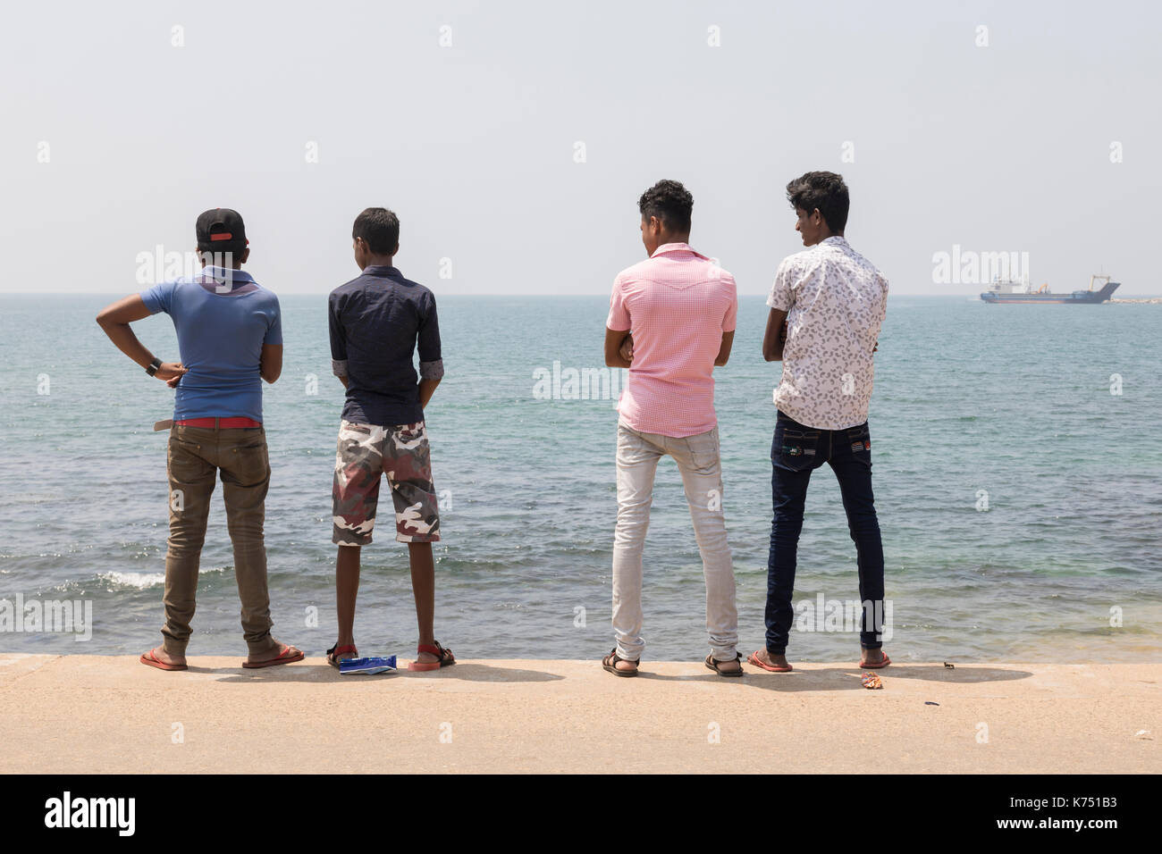 COLOMBO, SRI LANKA – February 10th, 2017: Four Young men standing on ...