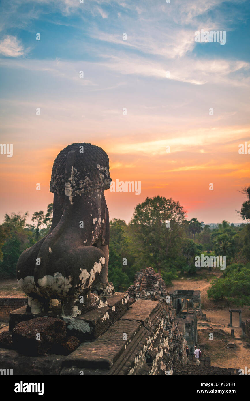 Lion figure as guardian, temple ruin at sunset, Pre Rup temple, Angkor ...