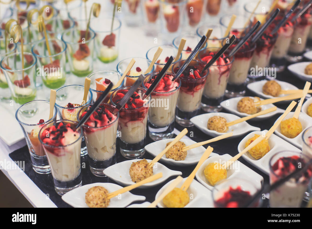 Beautifully decorated catering banquet table with different food snacks ...