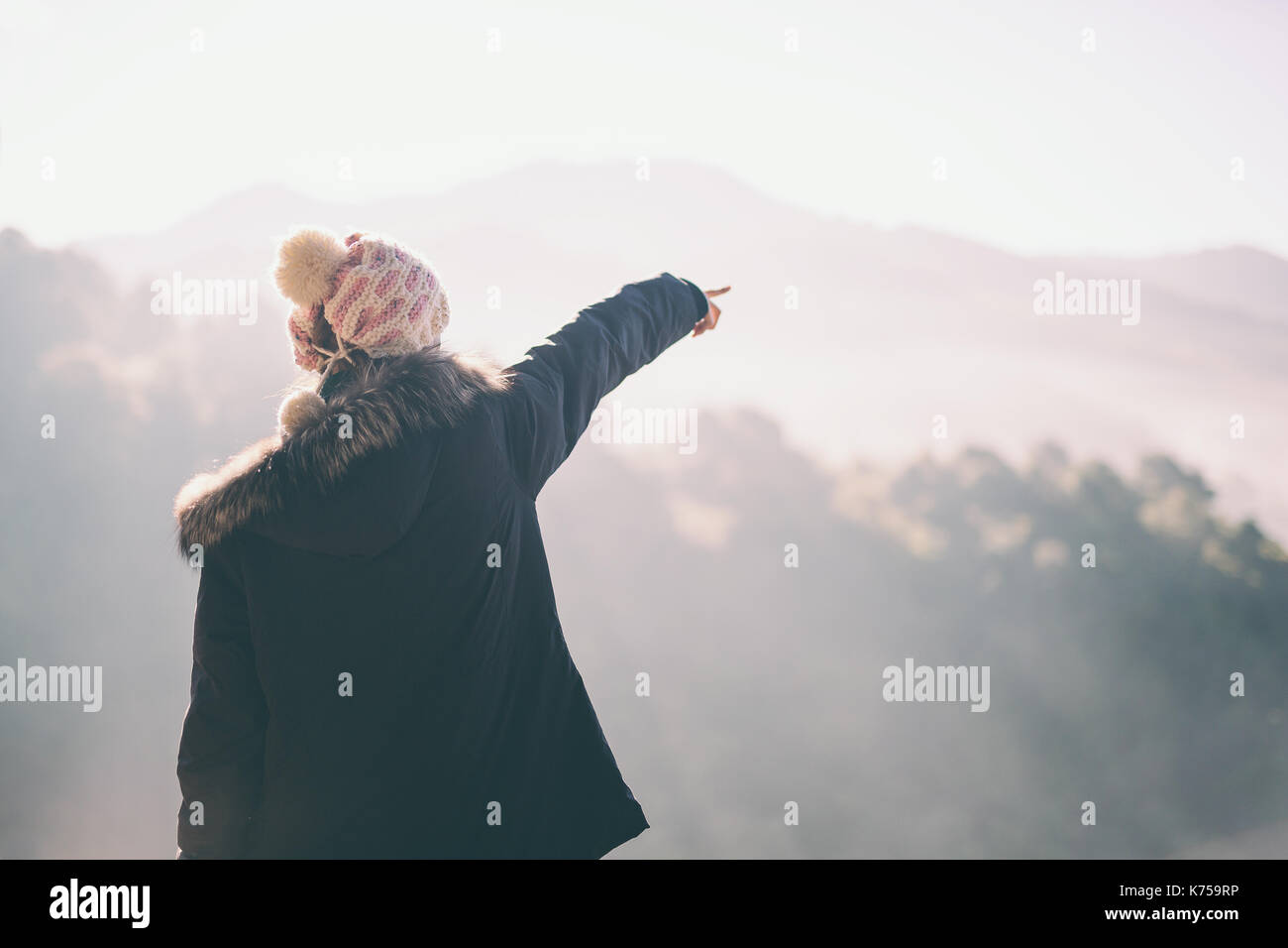 woman Beautiful Girls point to something at scenery Stock Photo - Alamy