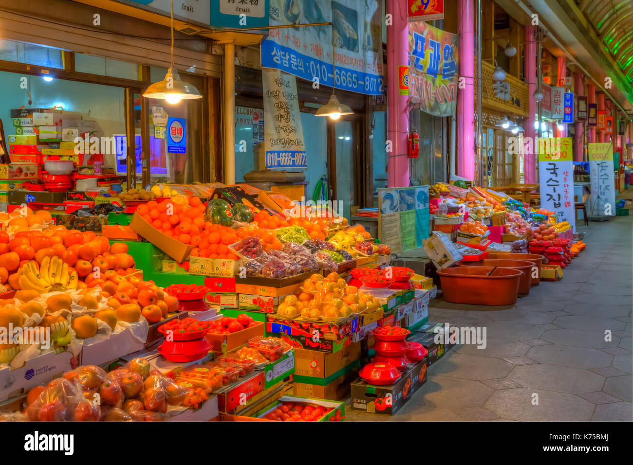 A fresh fruit market at night near the port of Incheon, South Korea ...