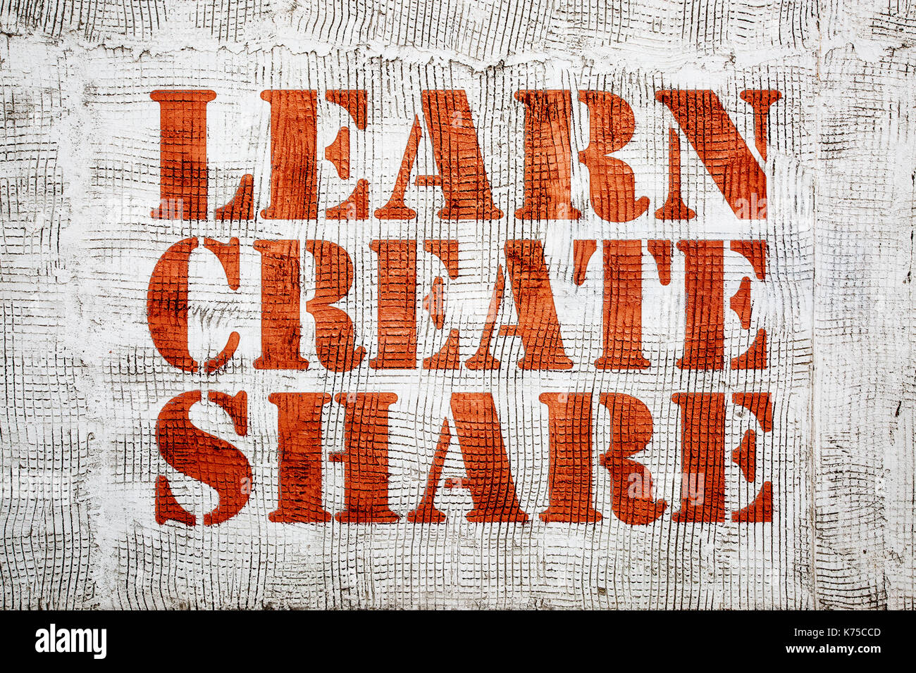 learn, create, share - graffiti sign with arrow on stucco wall Stock ...