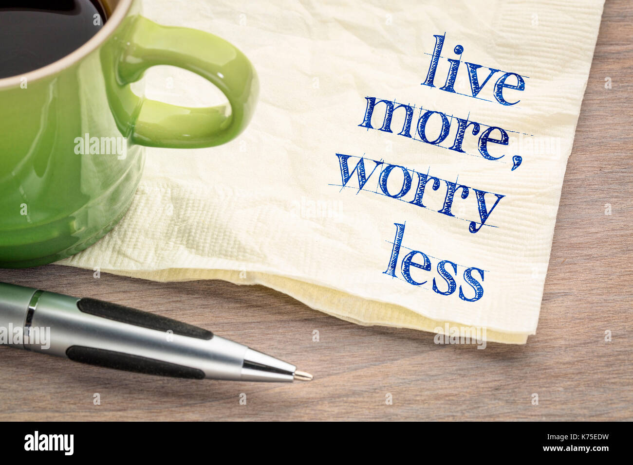 live more, worry less text - inspirational handwriting on a napkin with ...