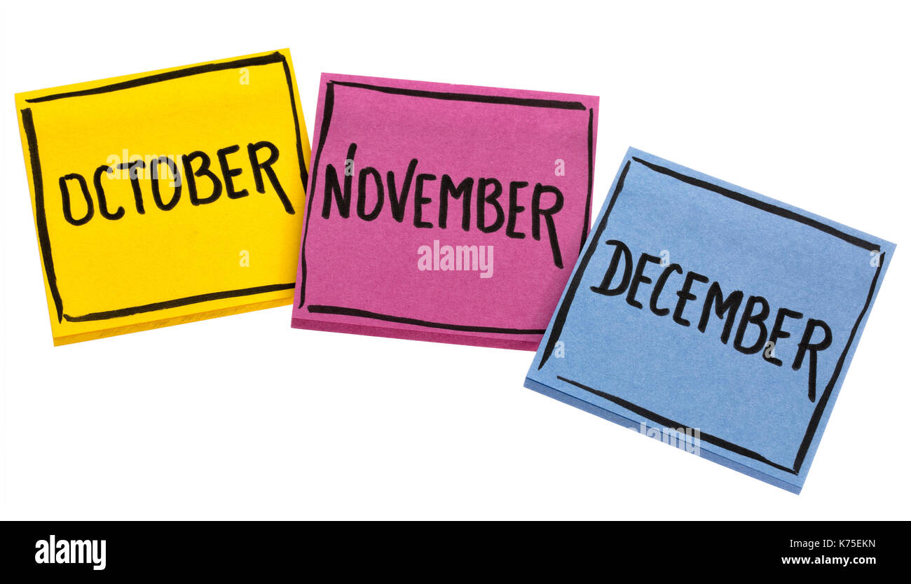 October, November and December - handwriting in black ink on isolated ...